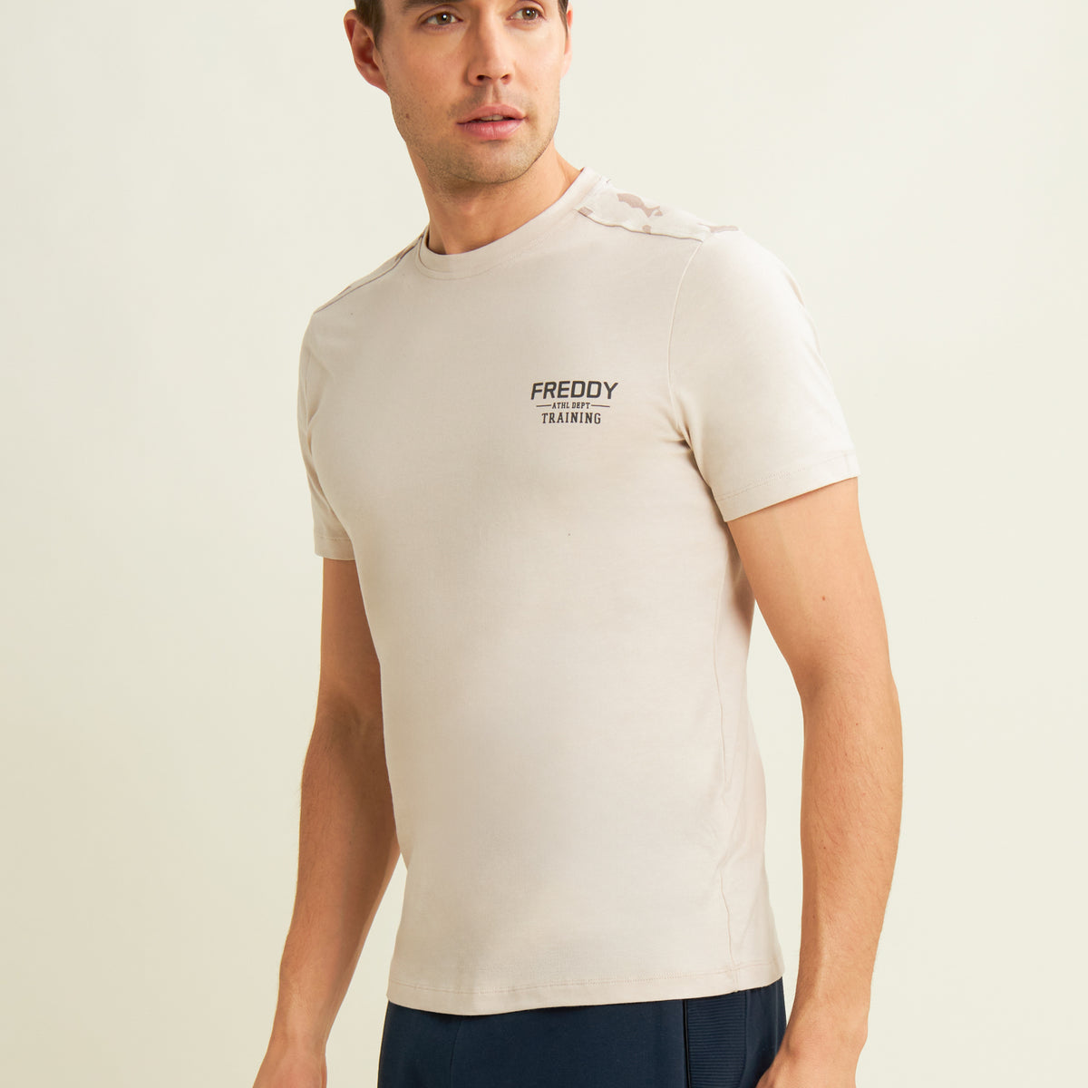T-shirt with camouflage inserts and chest logo